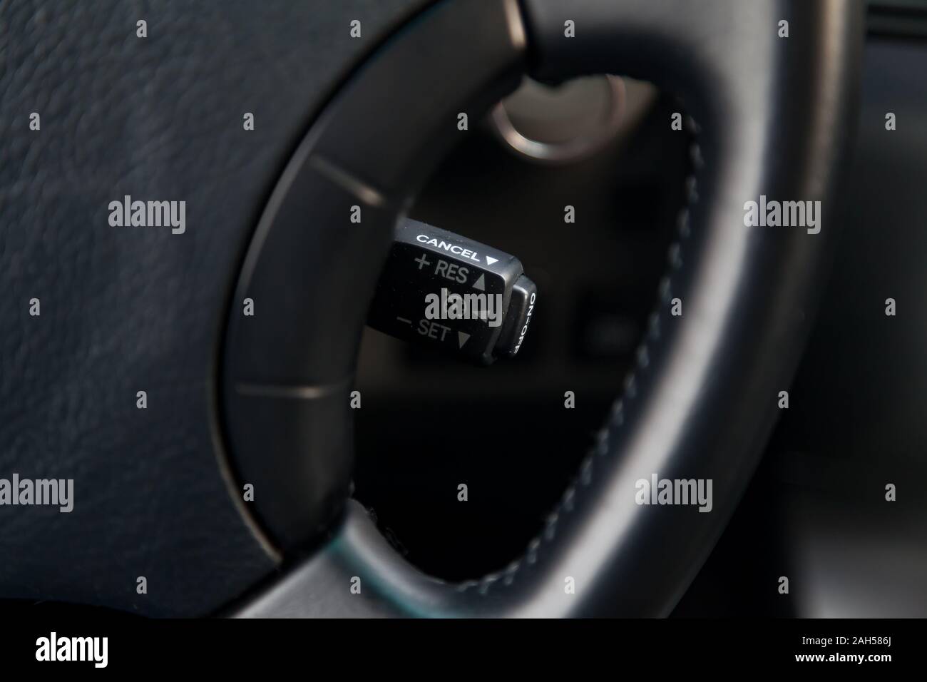 The shift lever to set the automatic cruise control speed inside the ...