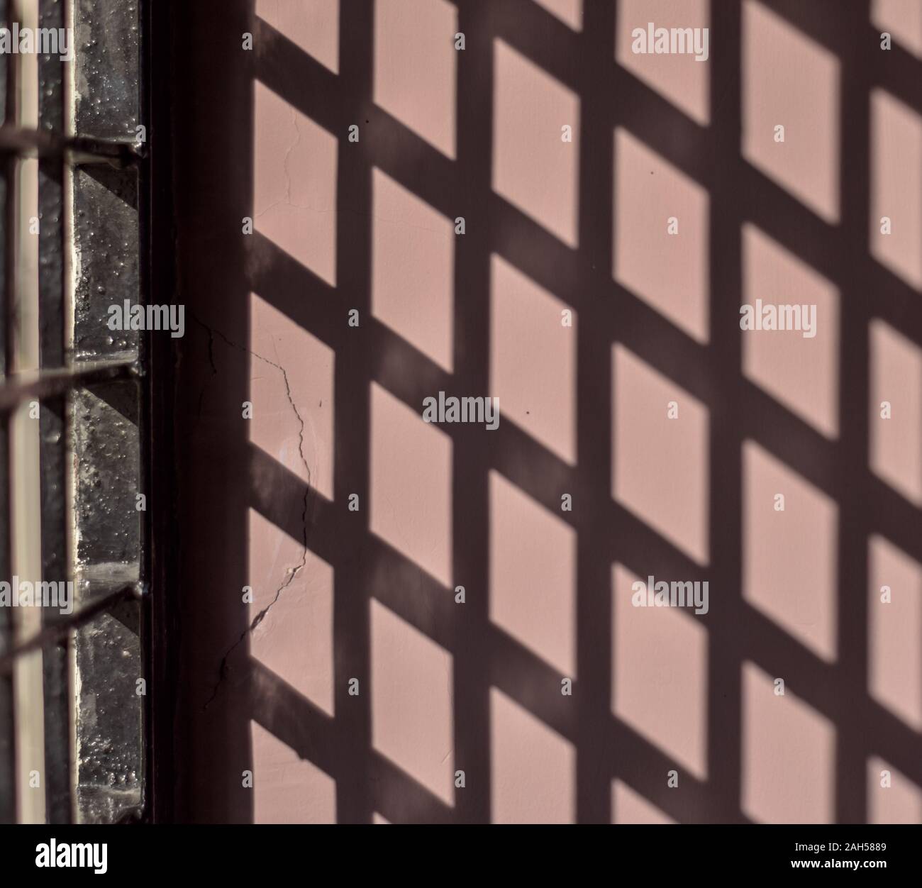 Jail cell shadow on the wall Stock Photo - Alamy