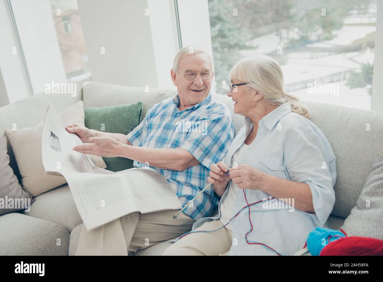 Grandfather reading newspaper grandmother hi-res stock photography and ...