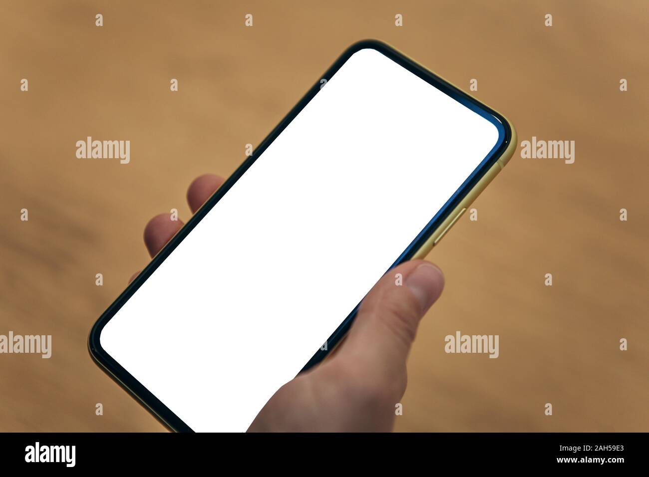 Human hand with a modern white screen phone for mockup Stock Photo - Alamy
