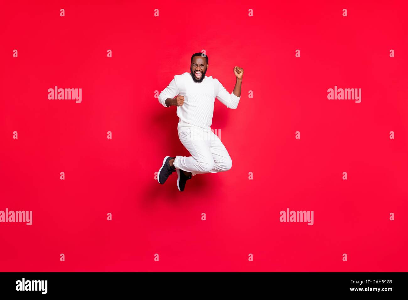 Full length photo of excited dark skin handsome guy jumping high ...