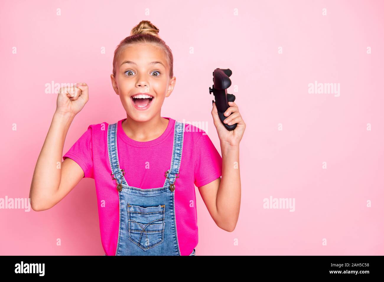Photo of excited cute nice blonde preteen girl having won contests at ...