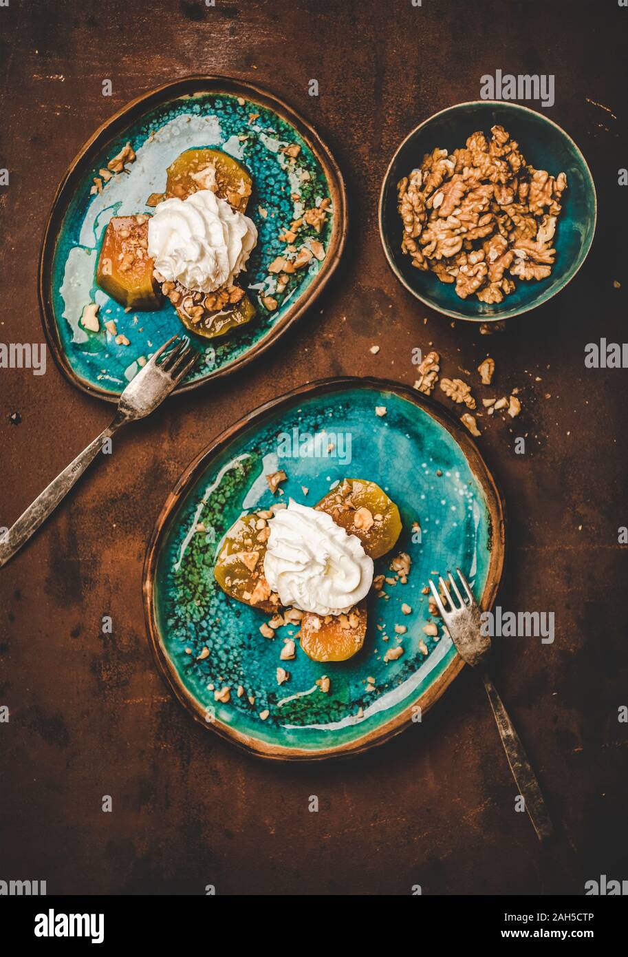 Turkish traditional dessert with pumpkin, walnuts and whipped cream ...