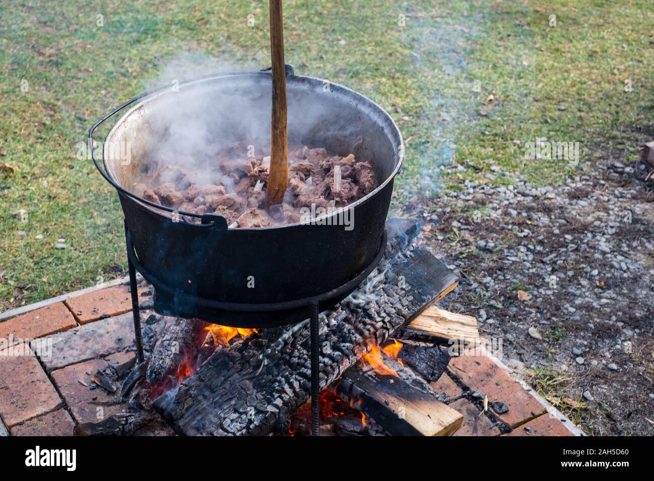 Romanian traditional food prepared at the cauldron on the open fire ...