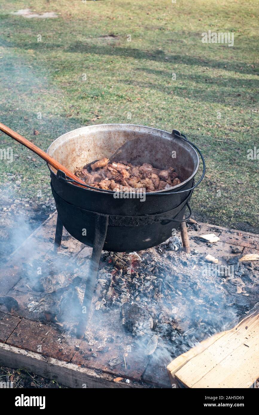 Romanian traditional food prepared at the cauldron on the open fire ...