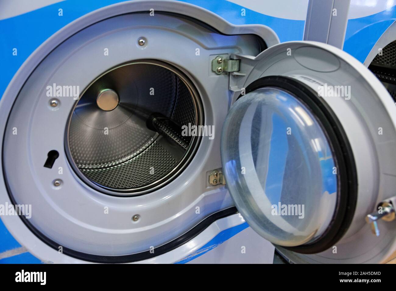 washing machine with open door in the laundry room Stock Photo - Alamy