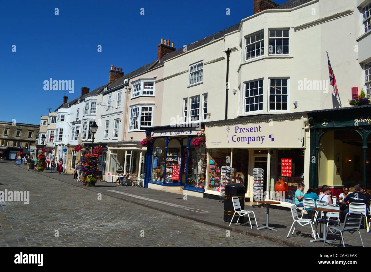 People outside a cafe in Wells town centre, Somerset, UK Stock Photo ...