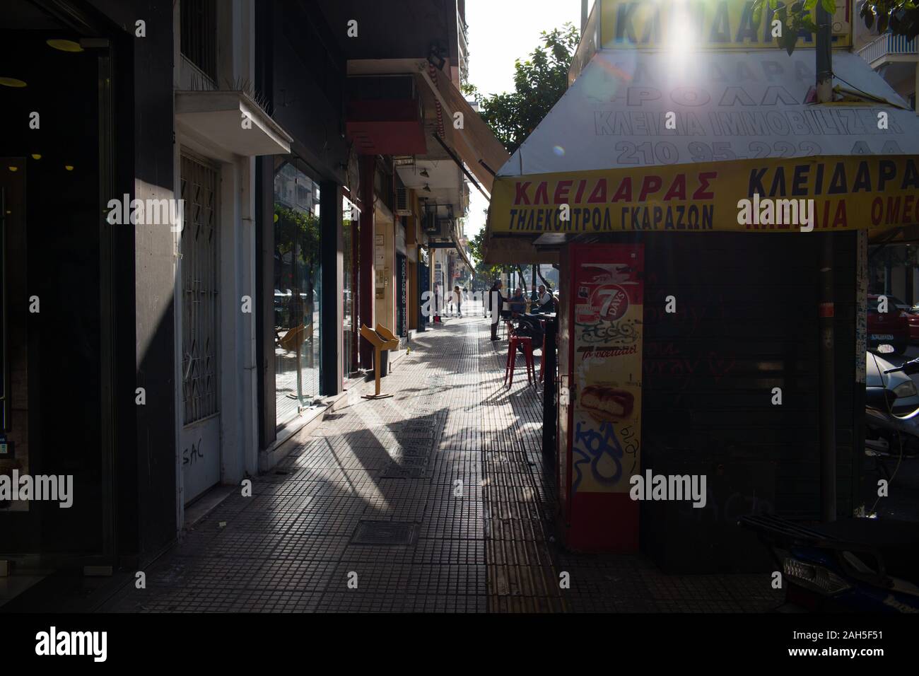 Sidewalk shade, Kallithea Athens Greece Stock Photo - Alamy