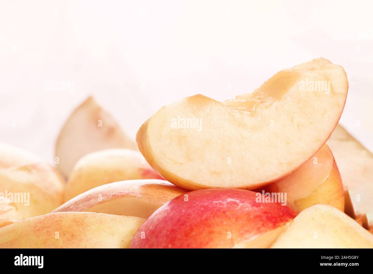 Fresh red apple fruit slice isolated on blur background Stock Photo - Alamy