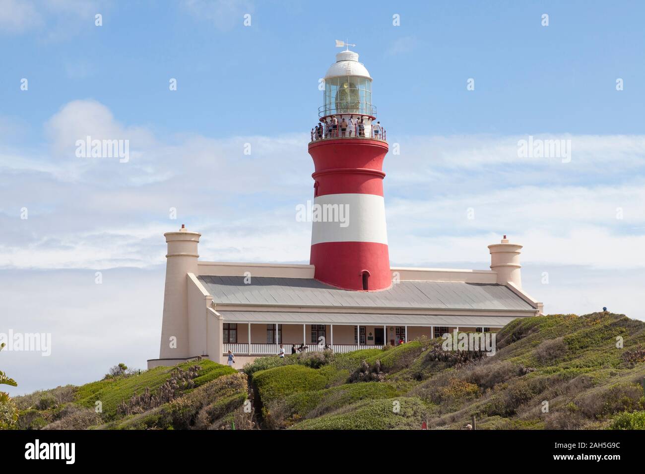 Tourists exploring the lighthouse at Cape Agulhas, Overberg, Western ...
