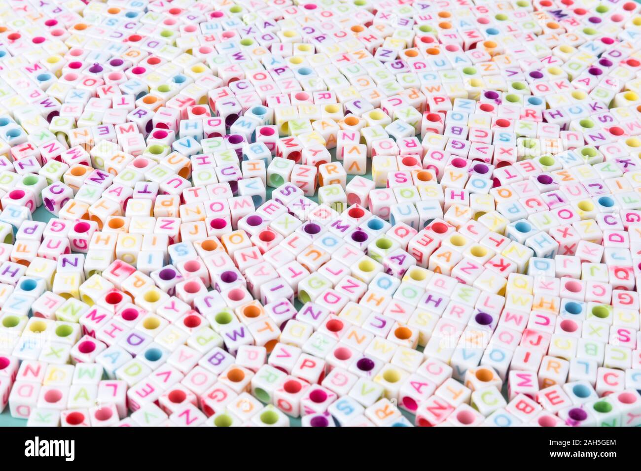 Square alphabet letter beads with multicolored characters Stock Photo ...