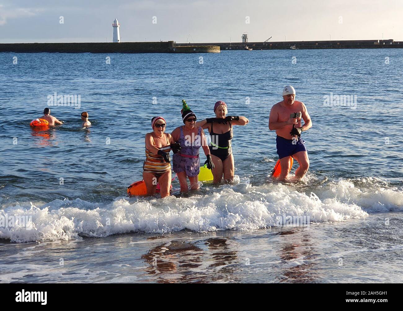 Members of the Donaghadee Chunky Dunkers take part in a Christmas ...