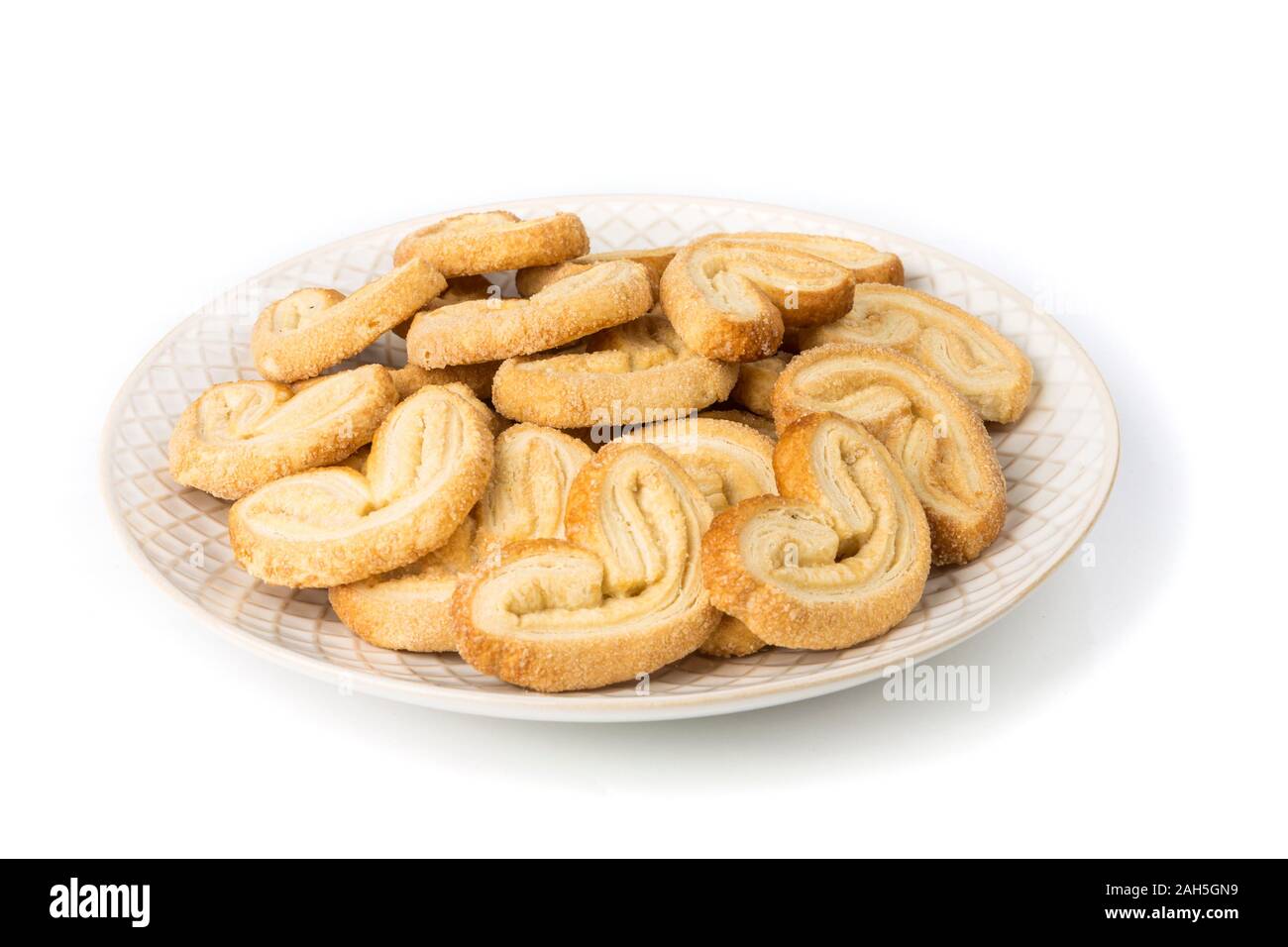 Plate full of sugar coated layered flaky cookies Stock Photo - Alamy