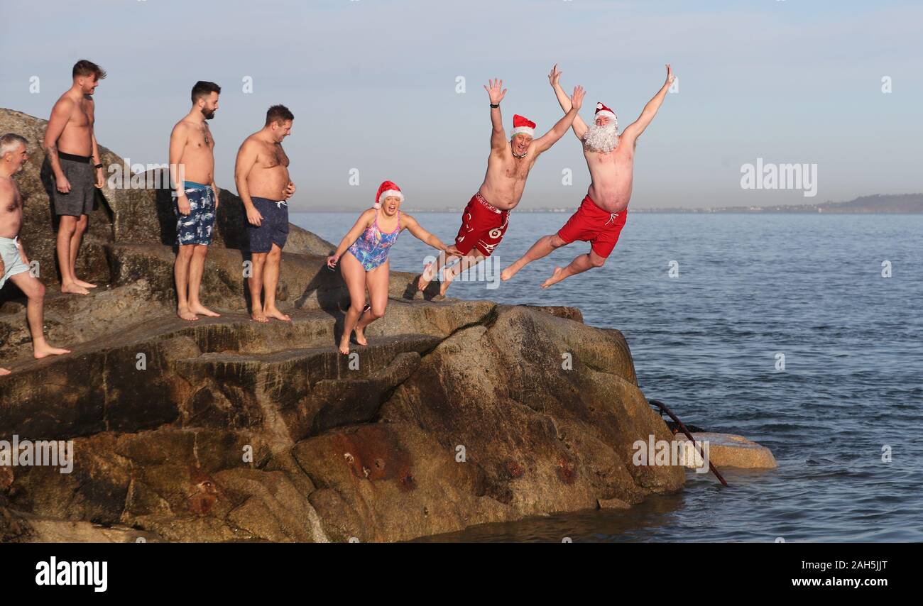 People take part in the annual Christmas Day swim at the Forty Foot ...