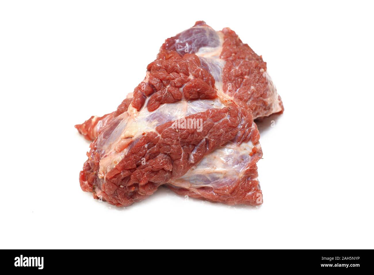 Raw beef parts isolated on white background Stock Photo - Alamy
