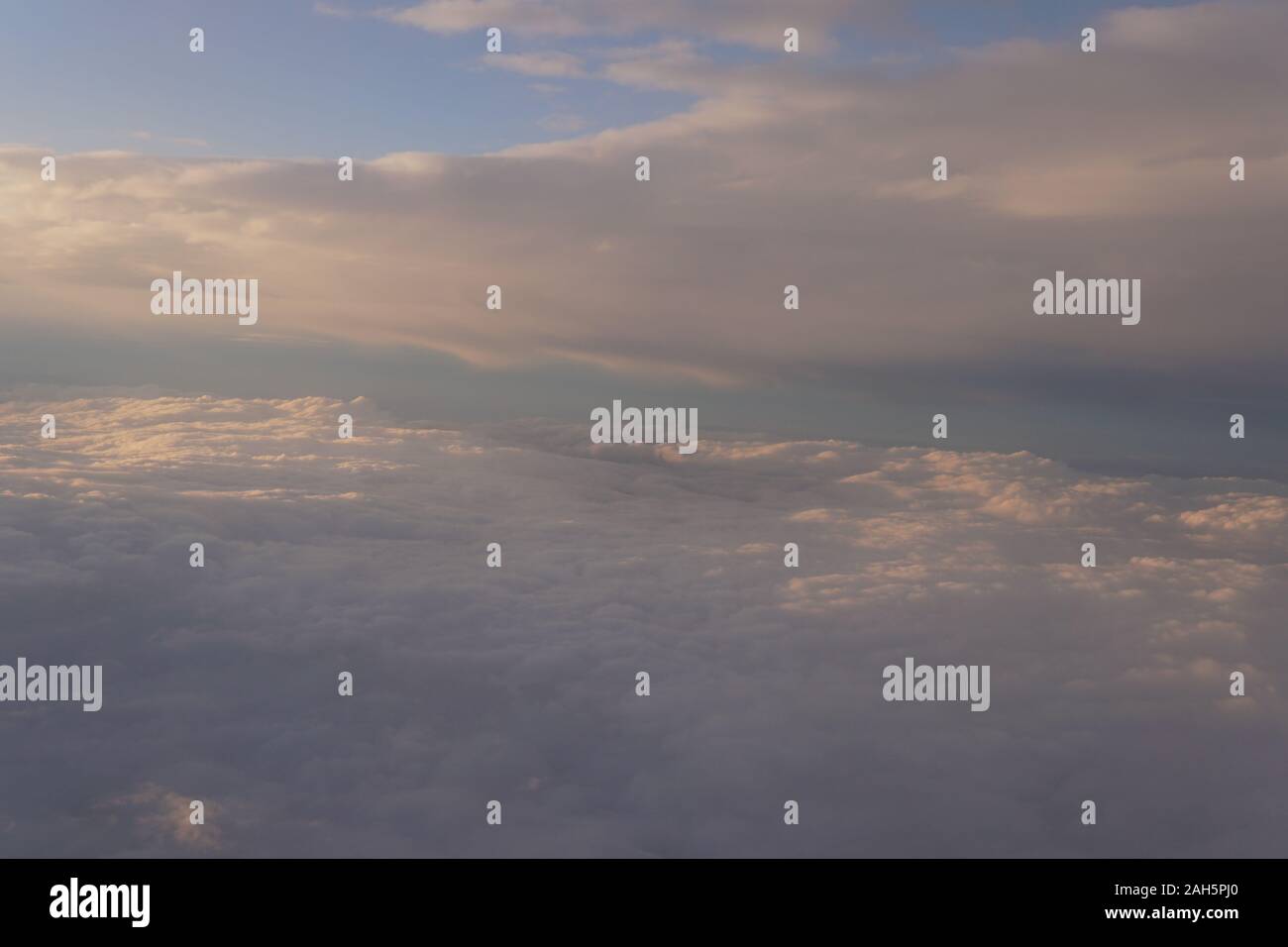 Sky with clouds at sunset from inside the plane landscape Stock Photo ...