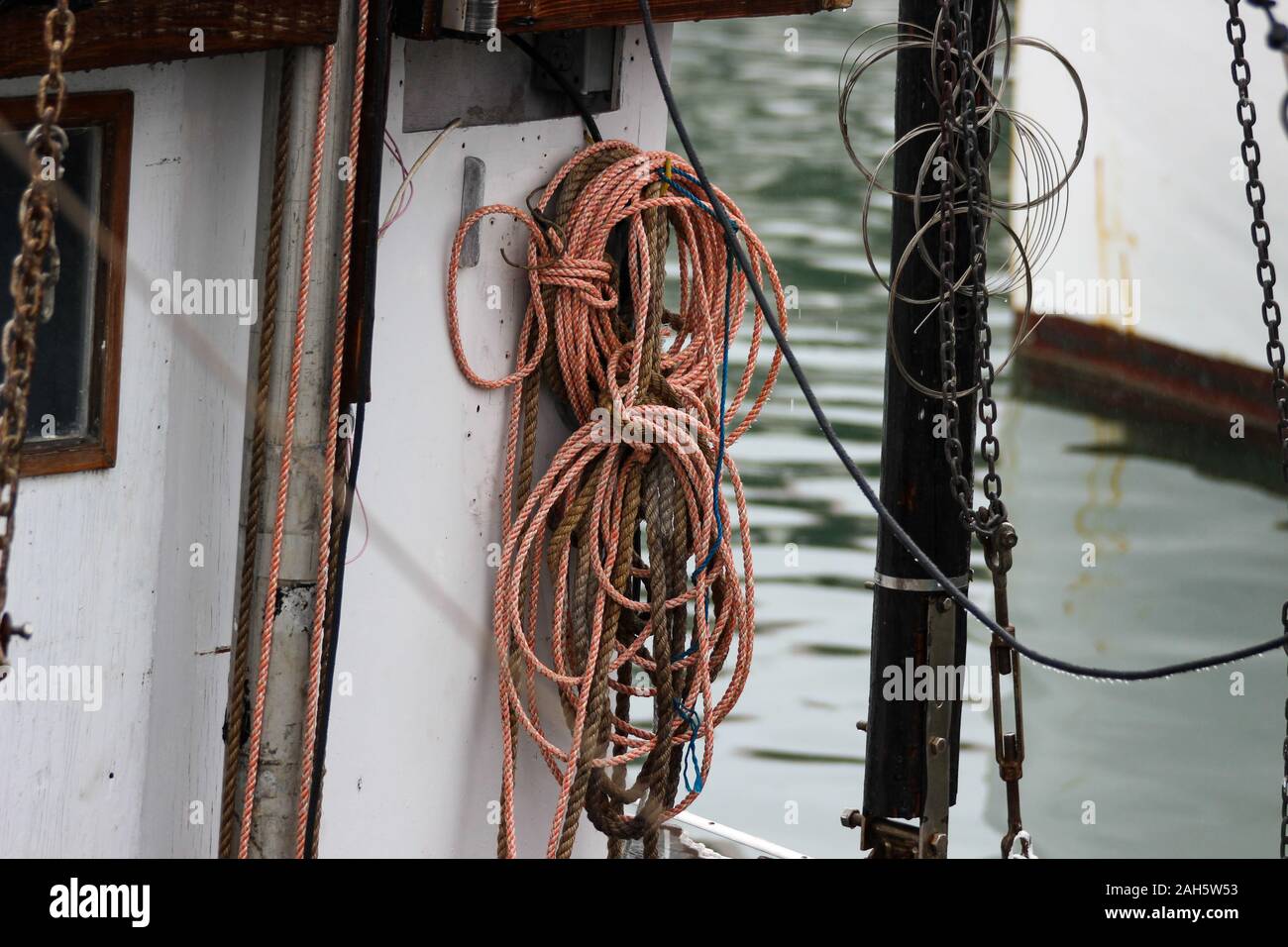 Hanging rope on a fishing boat Stock Photo - Alamy