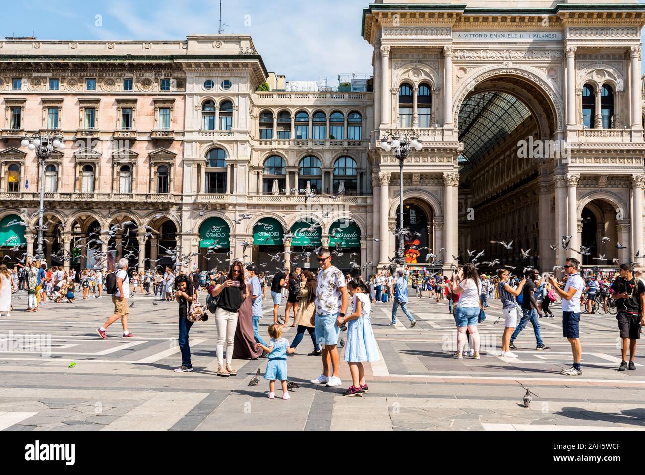 Tourist at the main square in front of the Duomo and Galleria Vittorio ...