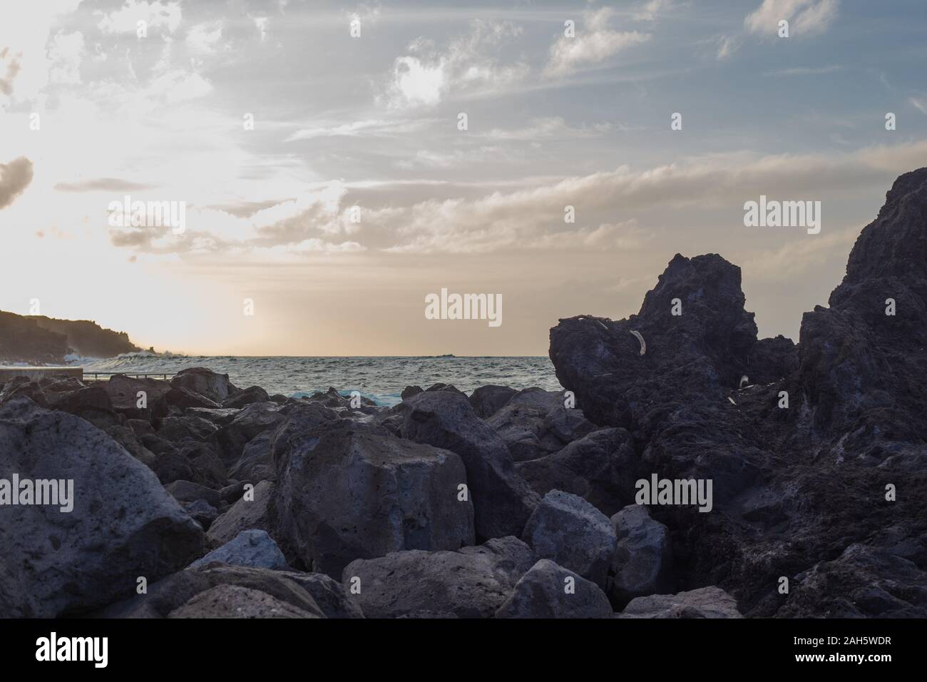 Lava stones on the beach of Piscinas Naturais Biscoitos. Atlantic Ocean ...