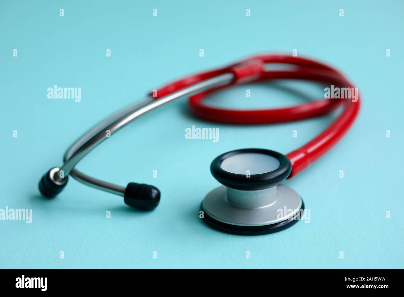 Red doctor stethoscope on blue modern background Stock Photo - Alamy