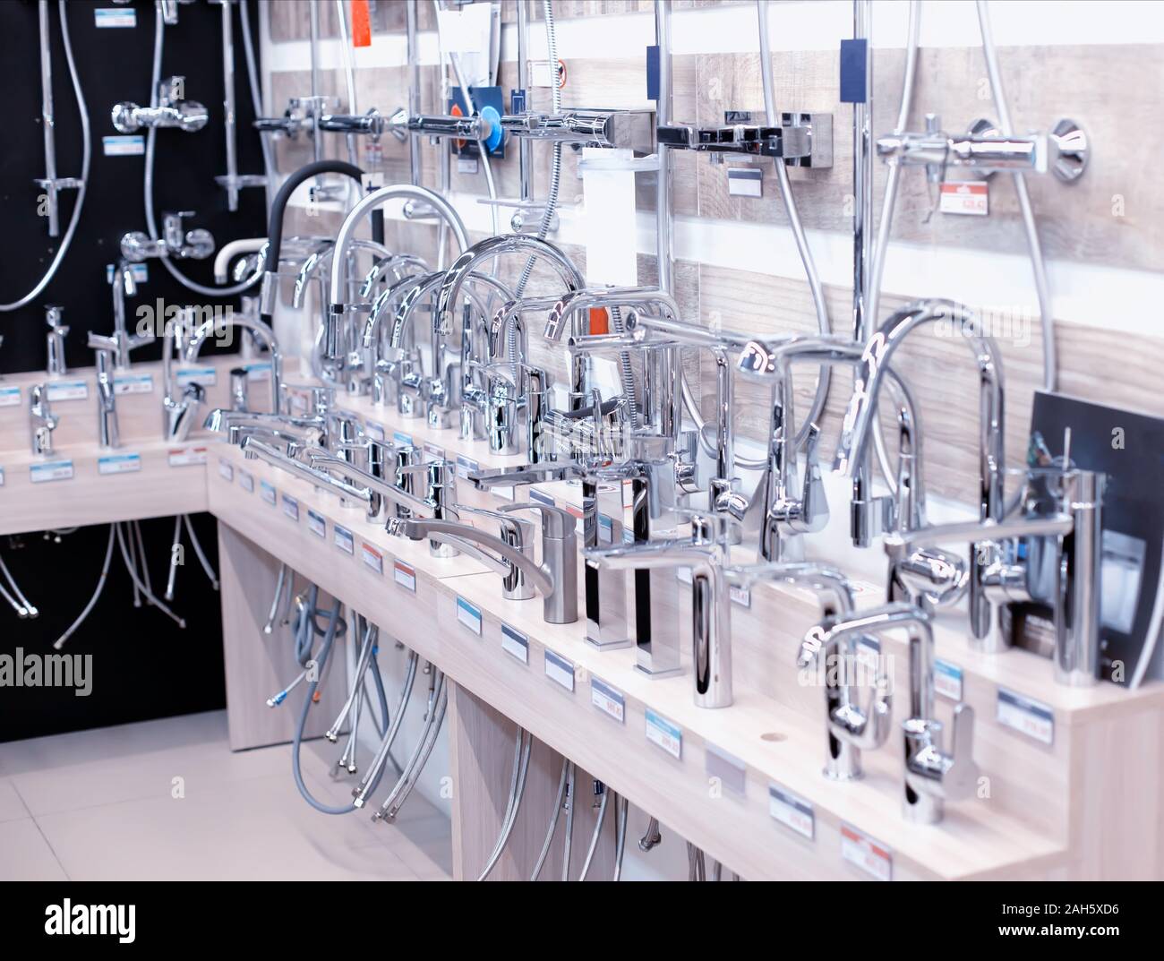 Sale of modern plumbing in the store. Water taps, kitchen and bathroom ...