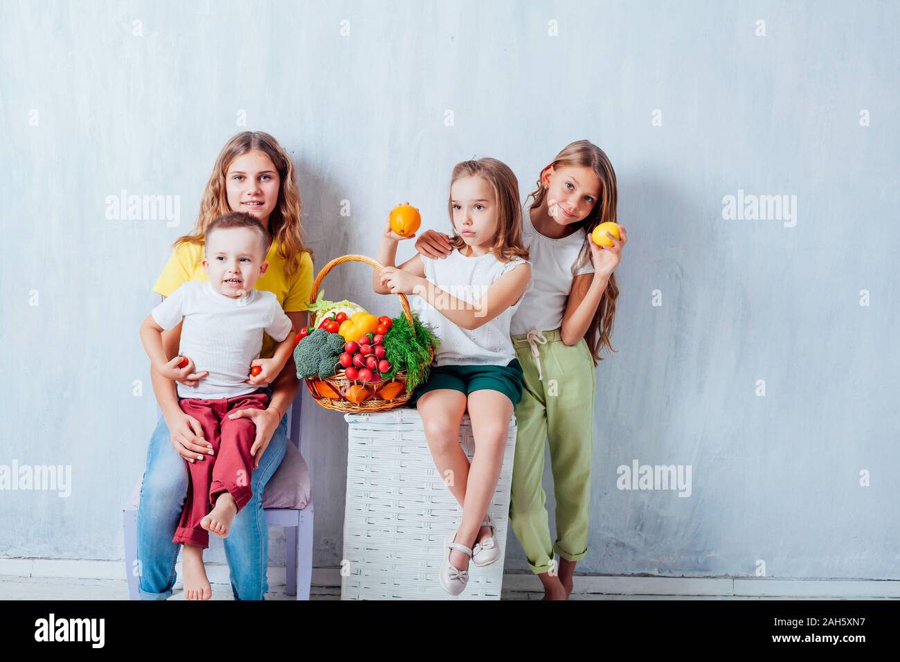 four children with fresh vegetables healthy food Stock Photo - Alamy