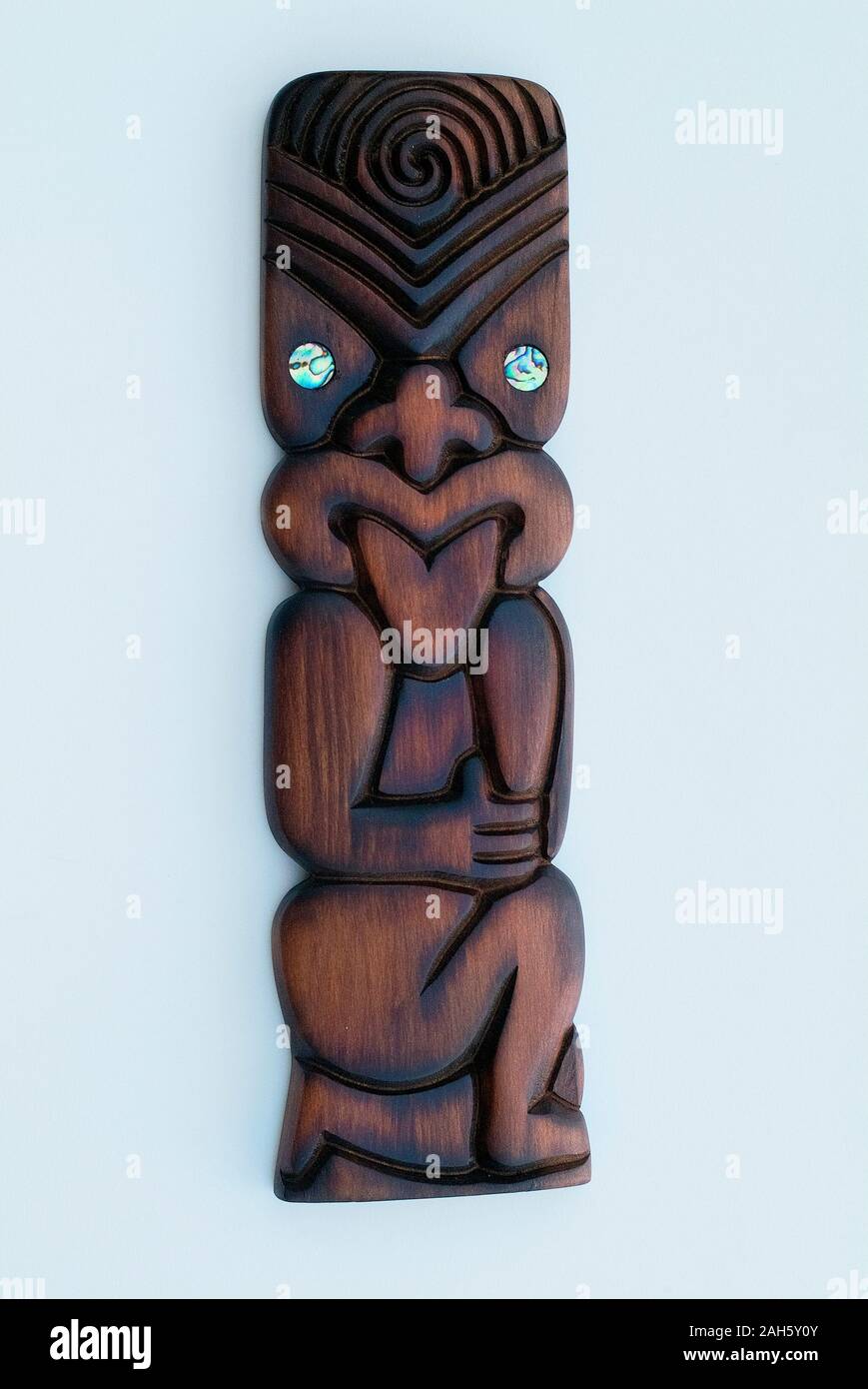New Zealand, wooden Maori sculpture with eayes made from paua shells ...