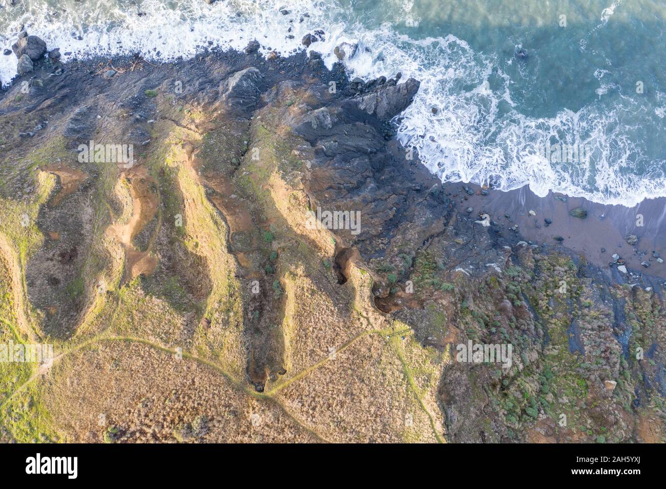 The Pacific Ocean washes against the scenic coastline of northern ...