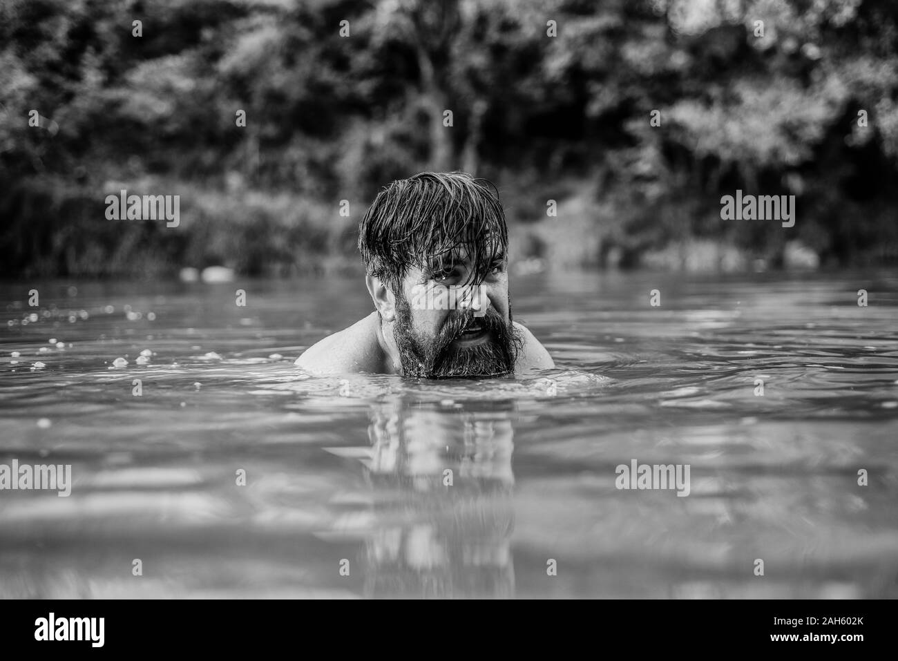 Swimming skills. Refreshing feeling. Man enjoy swimming in river or ...