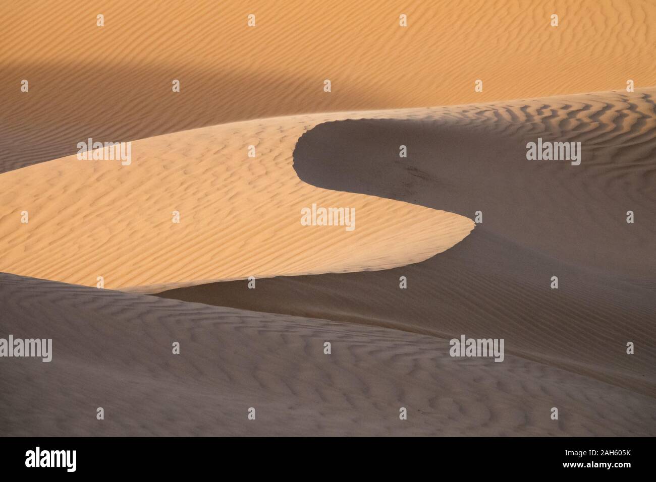 Background with beautiful structures of sandy dunes at sunrise in the ...