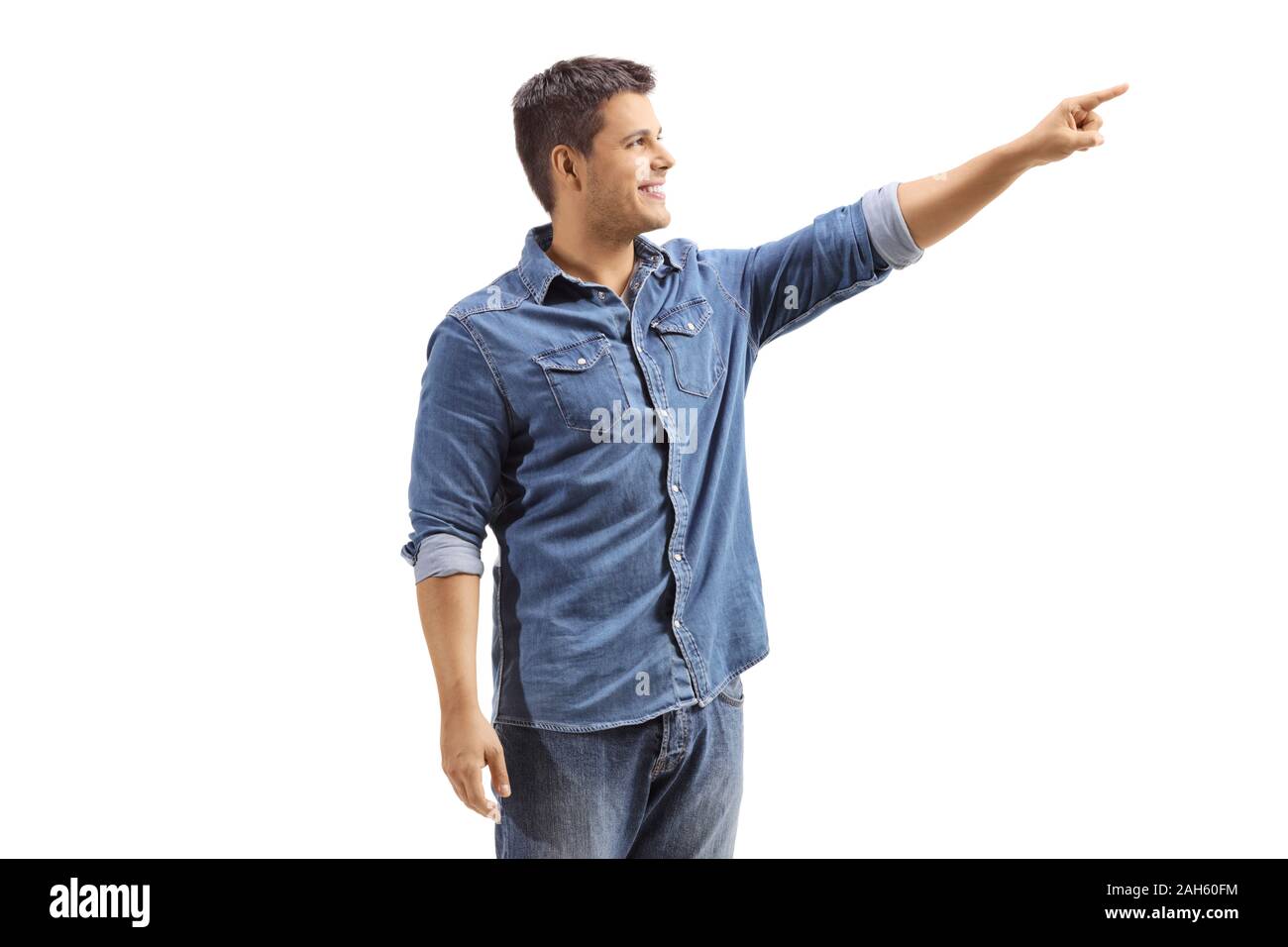 Casual young man pointing up isolated on white background Stock Photo ...