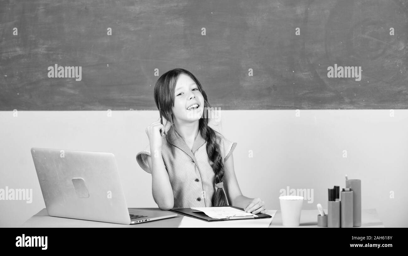 thinking girl. small girl pupil with laptop. smart school girl in ...