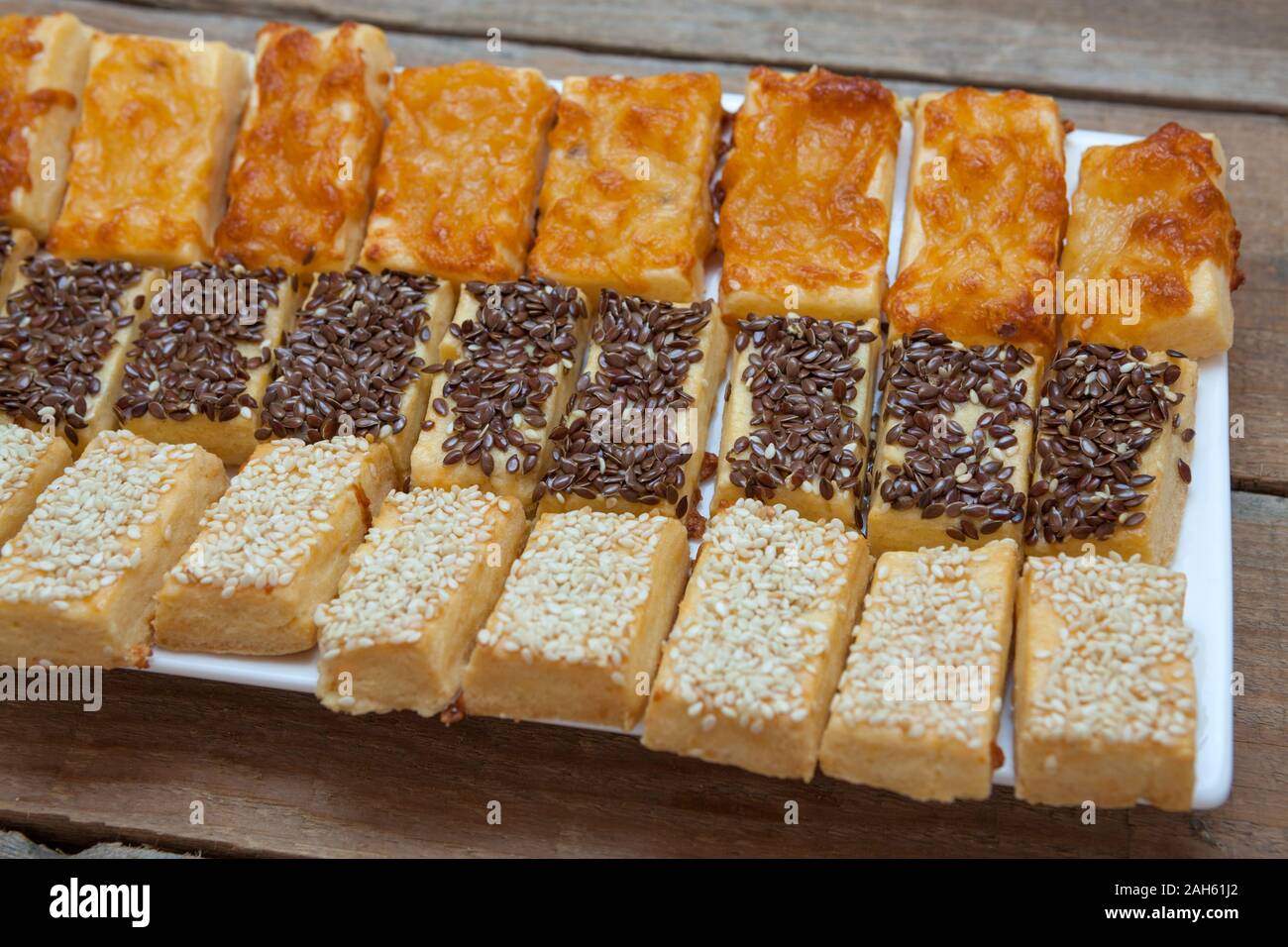 Salty pastries with cheese, sesame seeds and linseed Stock Photo - Alamy