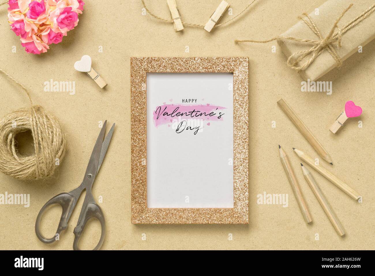 Mockup photo frame with kraft present boxes and craft rose flower for ...