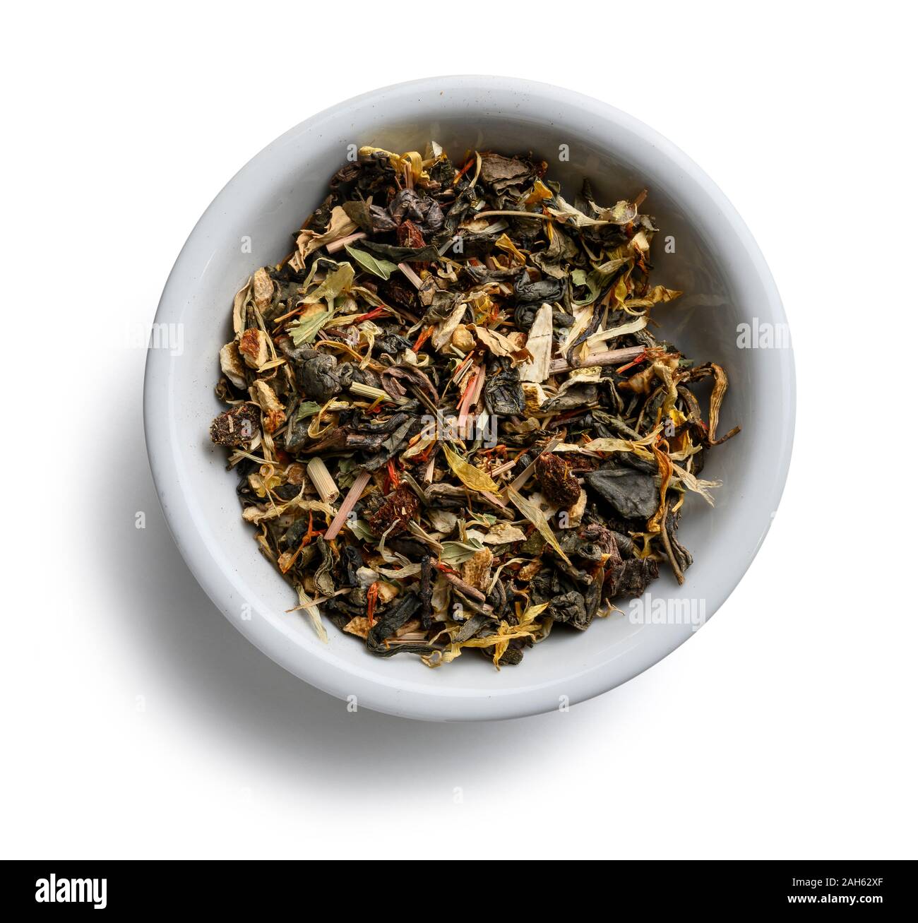 Green tea with aromatic additives. Top view on white background Stock ...