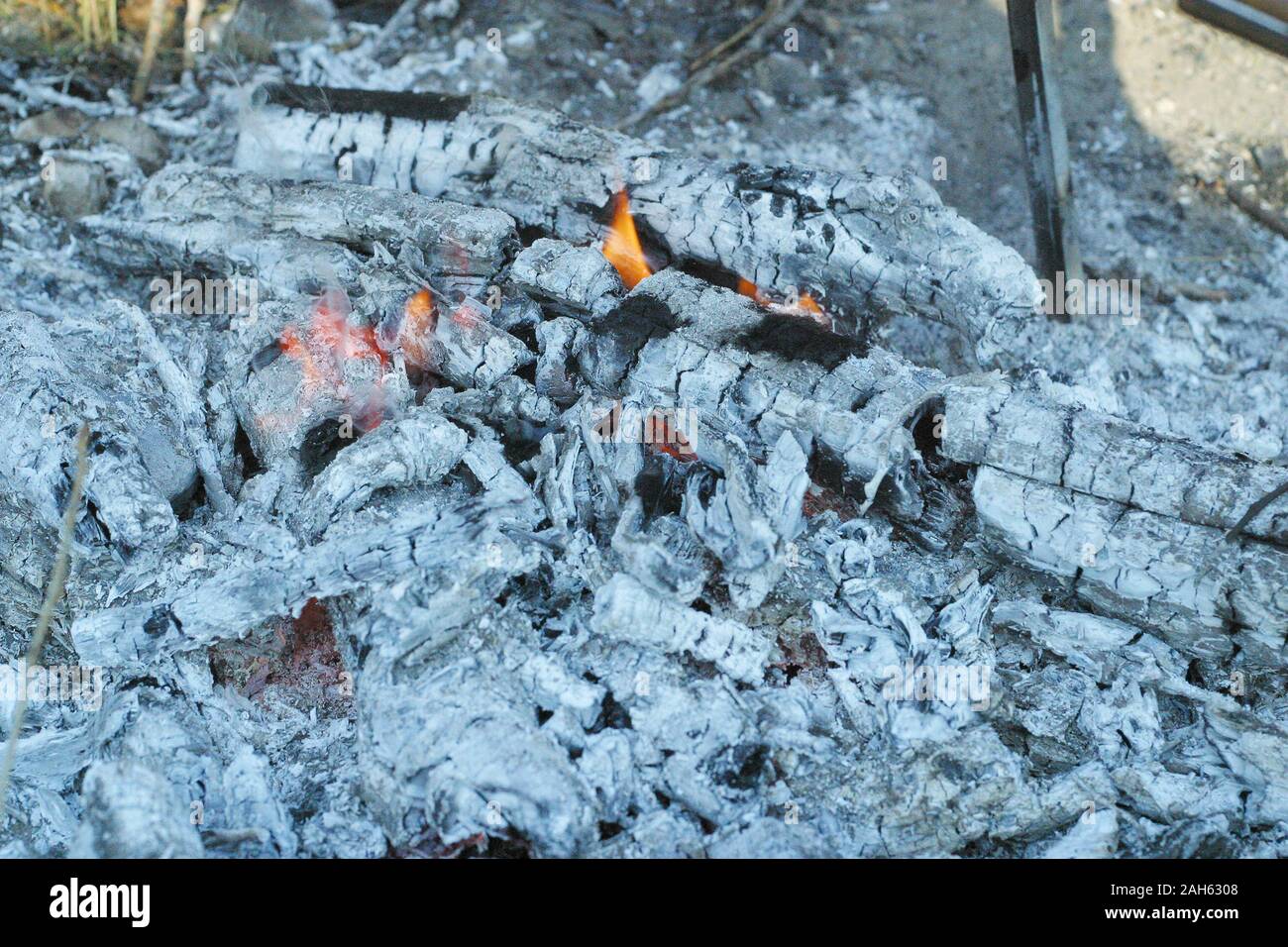 Ashes with some flames stayed after burning fire for preparing barbecue ...