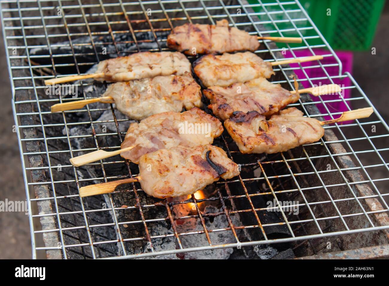 Grilled marinated pork with sauce Skewers and small Stock Photo - Alamy