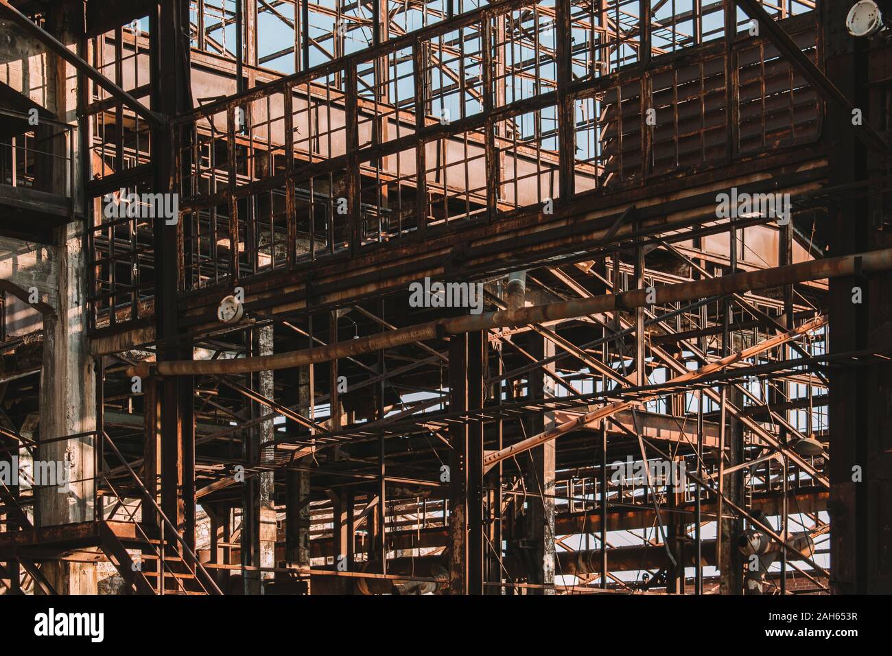Abstract rusted metal construction inside abandoned factory, industrial ...