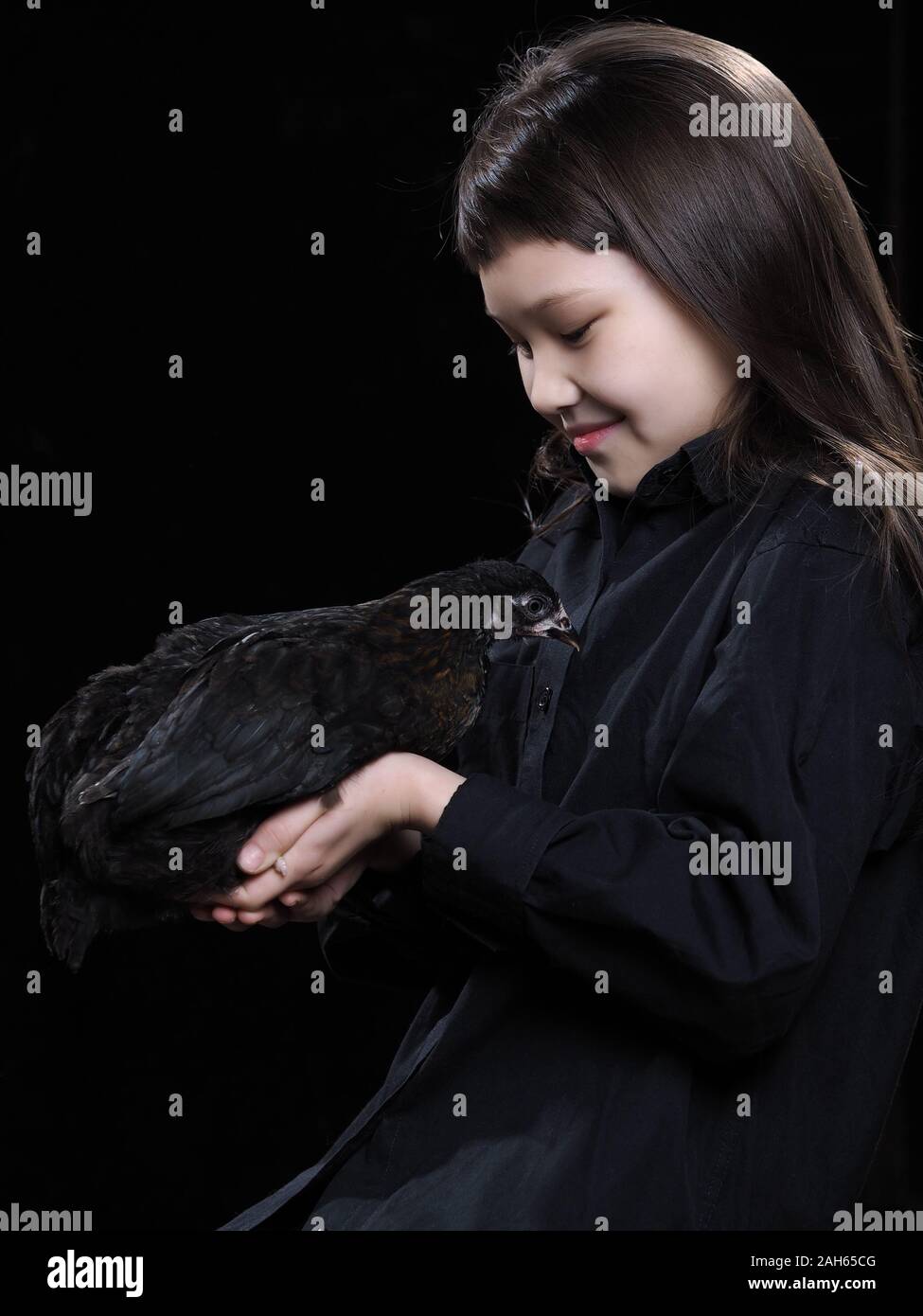 Child with a bird hi-res stock photography and images - Alamy