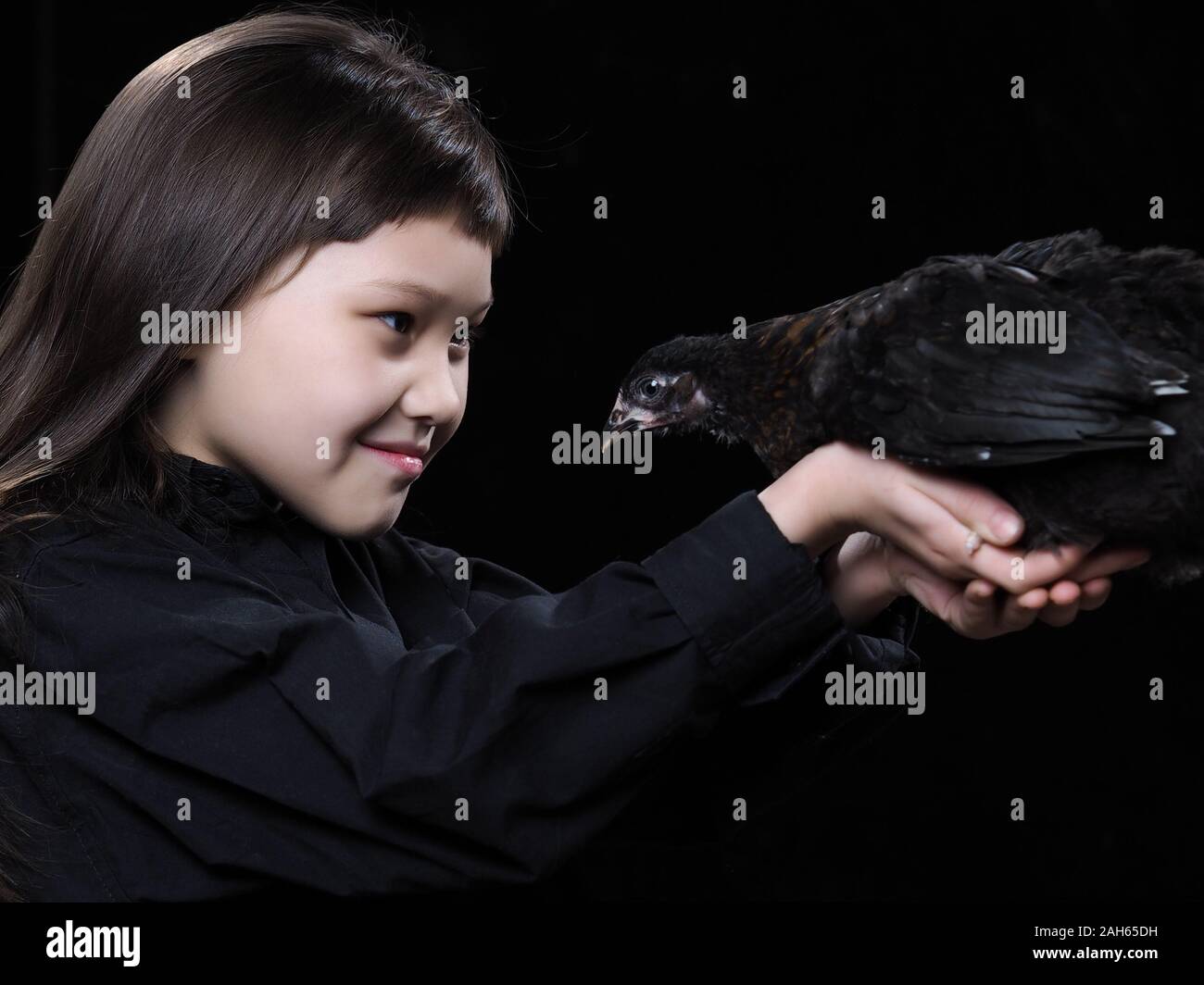 Child with a bird hi-res stock photography and images - Alamy