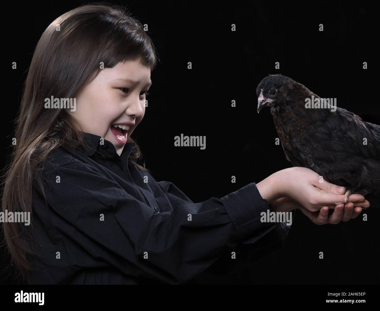 Emotional portrait of a child with a bird Stock Photo - Alamy