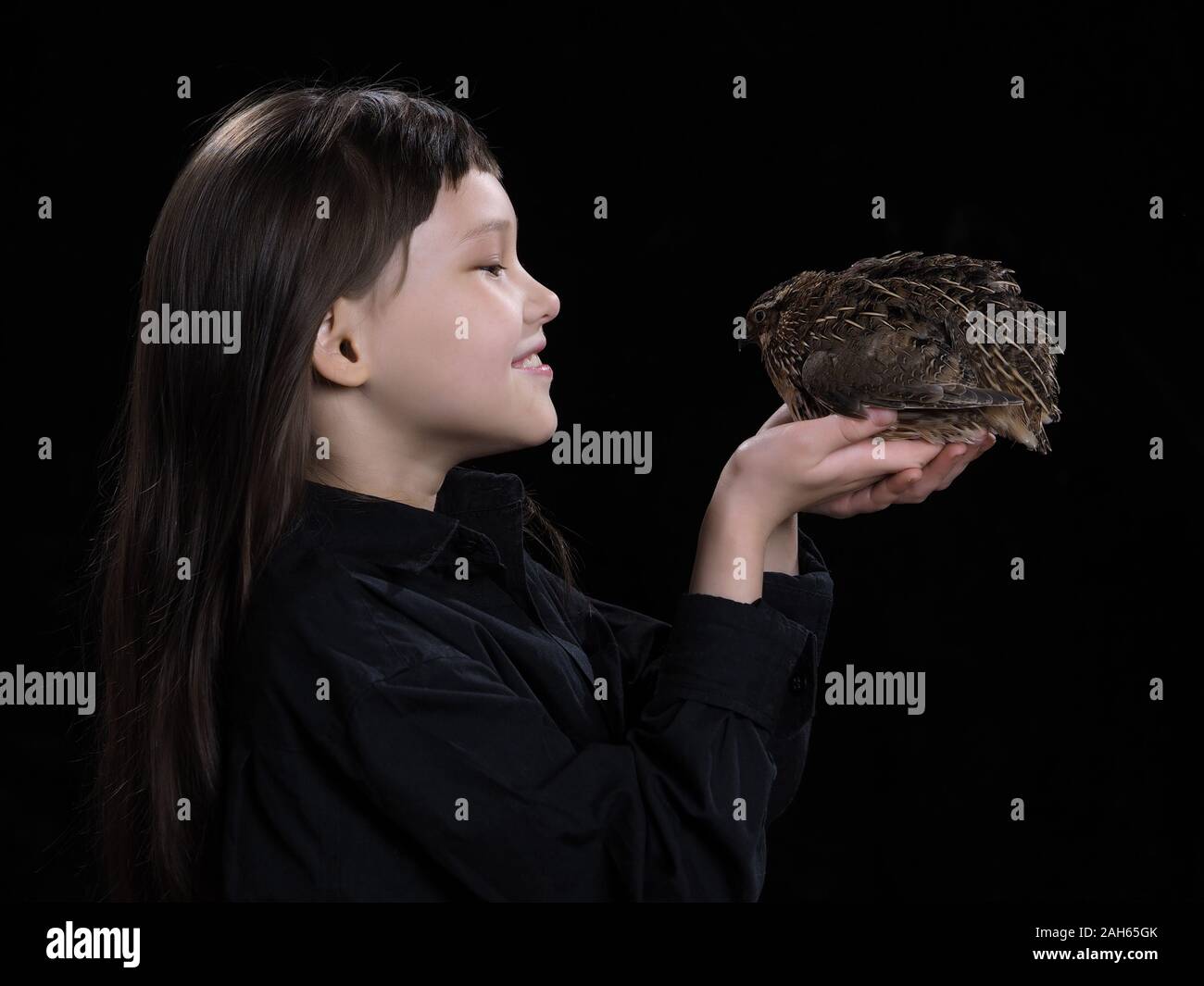 Emotional portrait of a child with a bird Stock Photo - Alamy