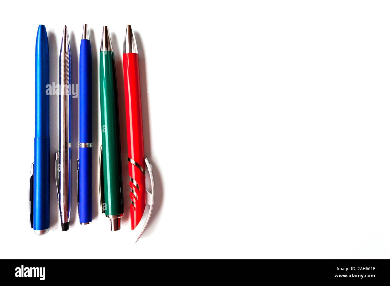 row selection of assorted multi colored ballpoint pens of different ...