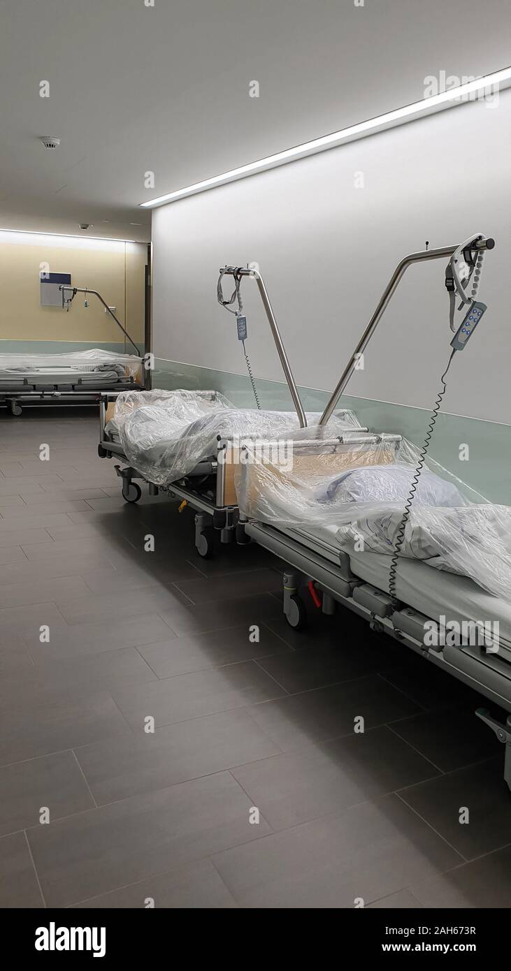 Beds for patients stand in the corridor of the clinic Stock Photo - Alamy