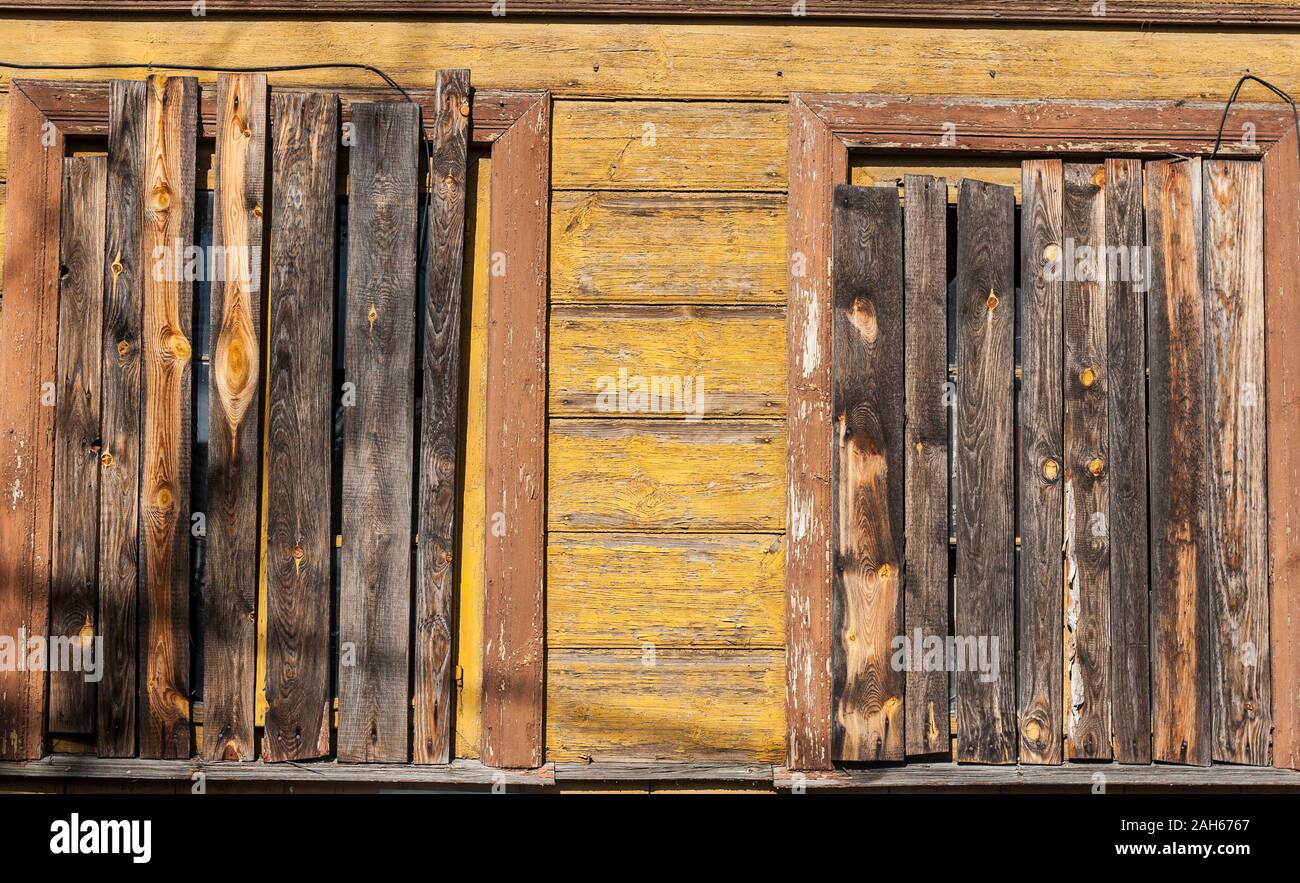 Windows of abandoned old wooden house hammered with planks Stock Photo ...