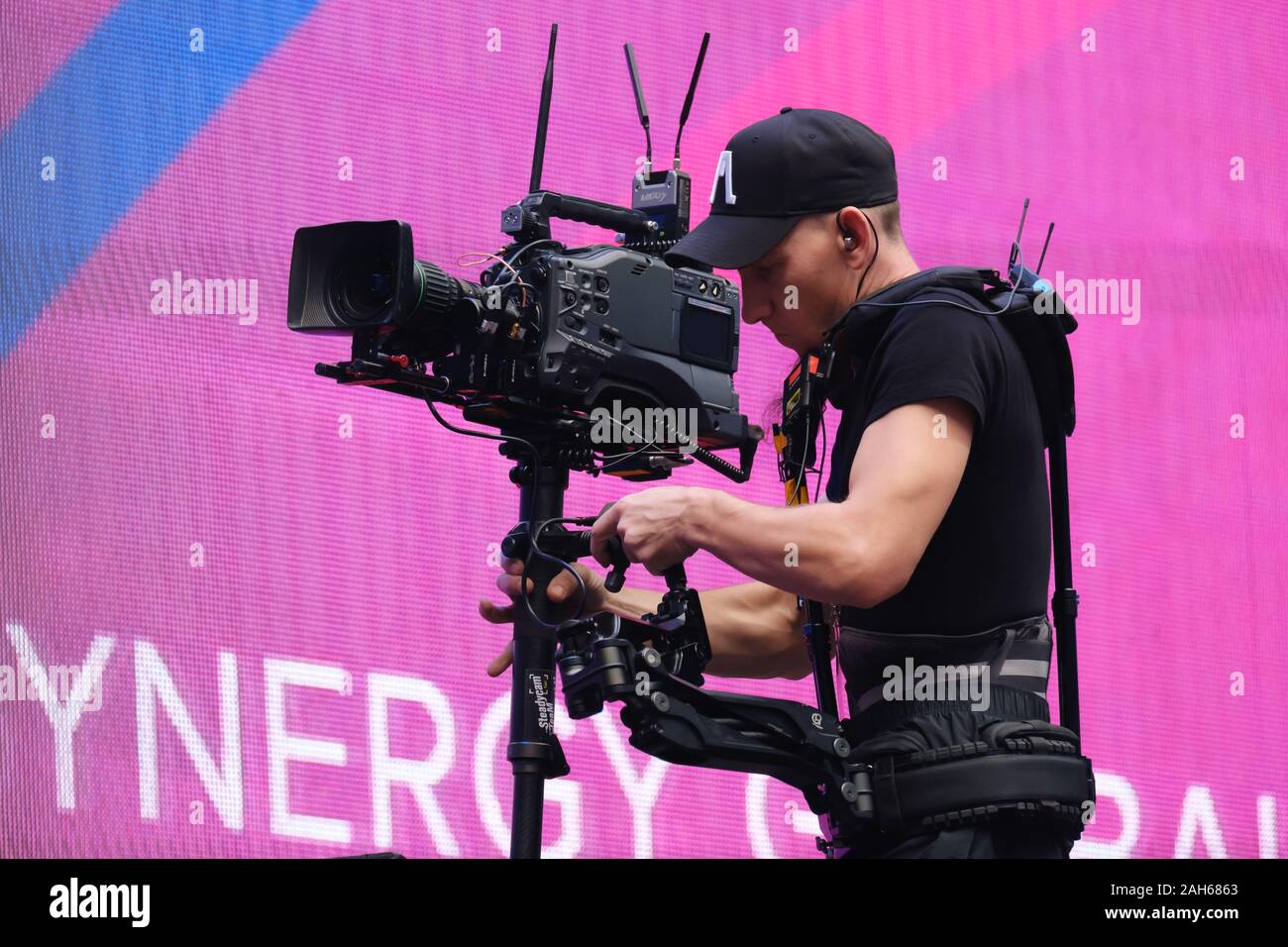 Steadicam camera man online broadcasting from stage Stock Photo - Alamy