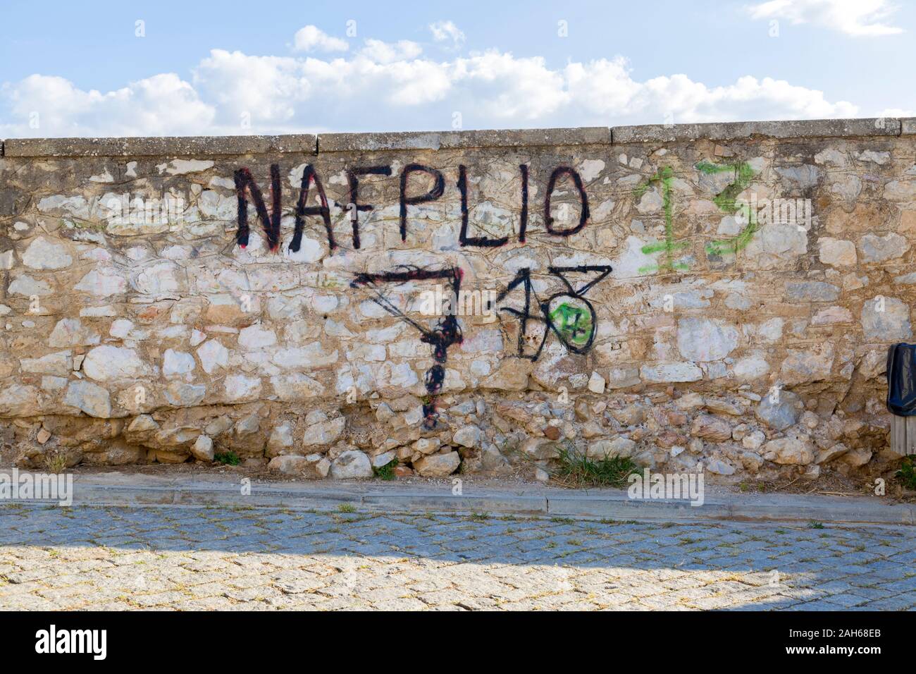 Graffiti on an ancient wall of stone ruins in Nafplio, Greece Stock ...