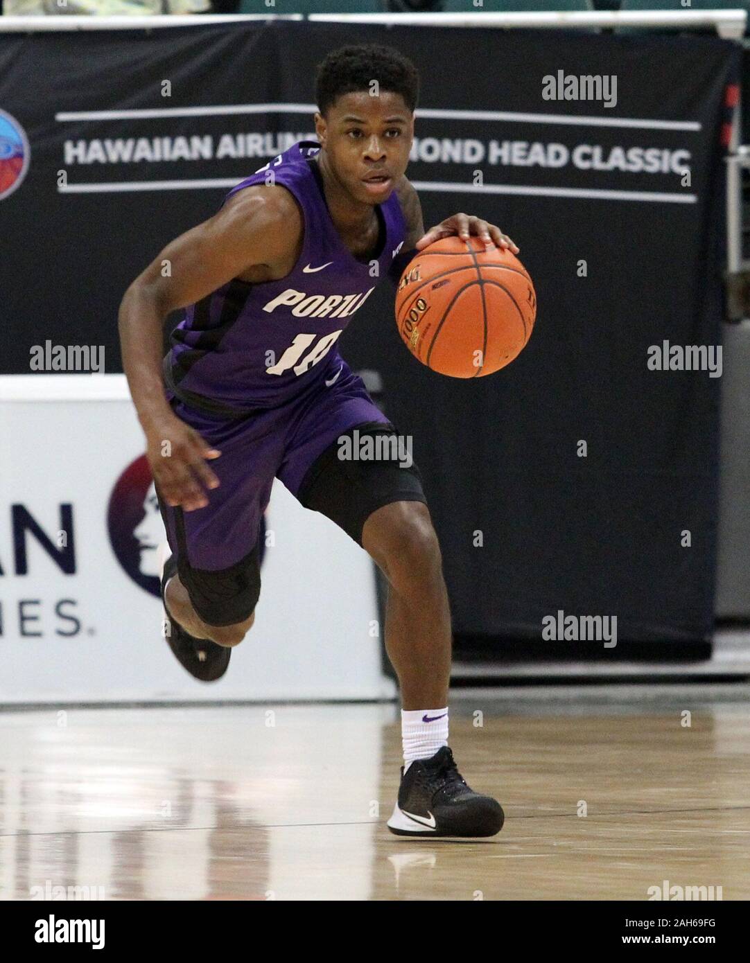 December 25, 2019 - Portland Pilots guard Chase Adams (10) brings the ...