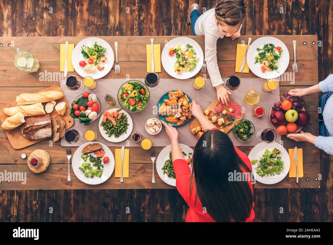 Buffet table woman putting food hi-res stock photography and images - Alamy