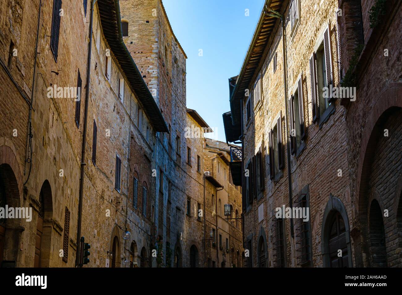 Medieval street in Siena city center, Italy Stock Photo - Alamy